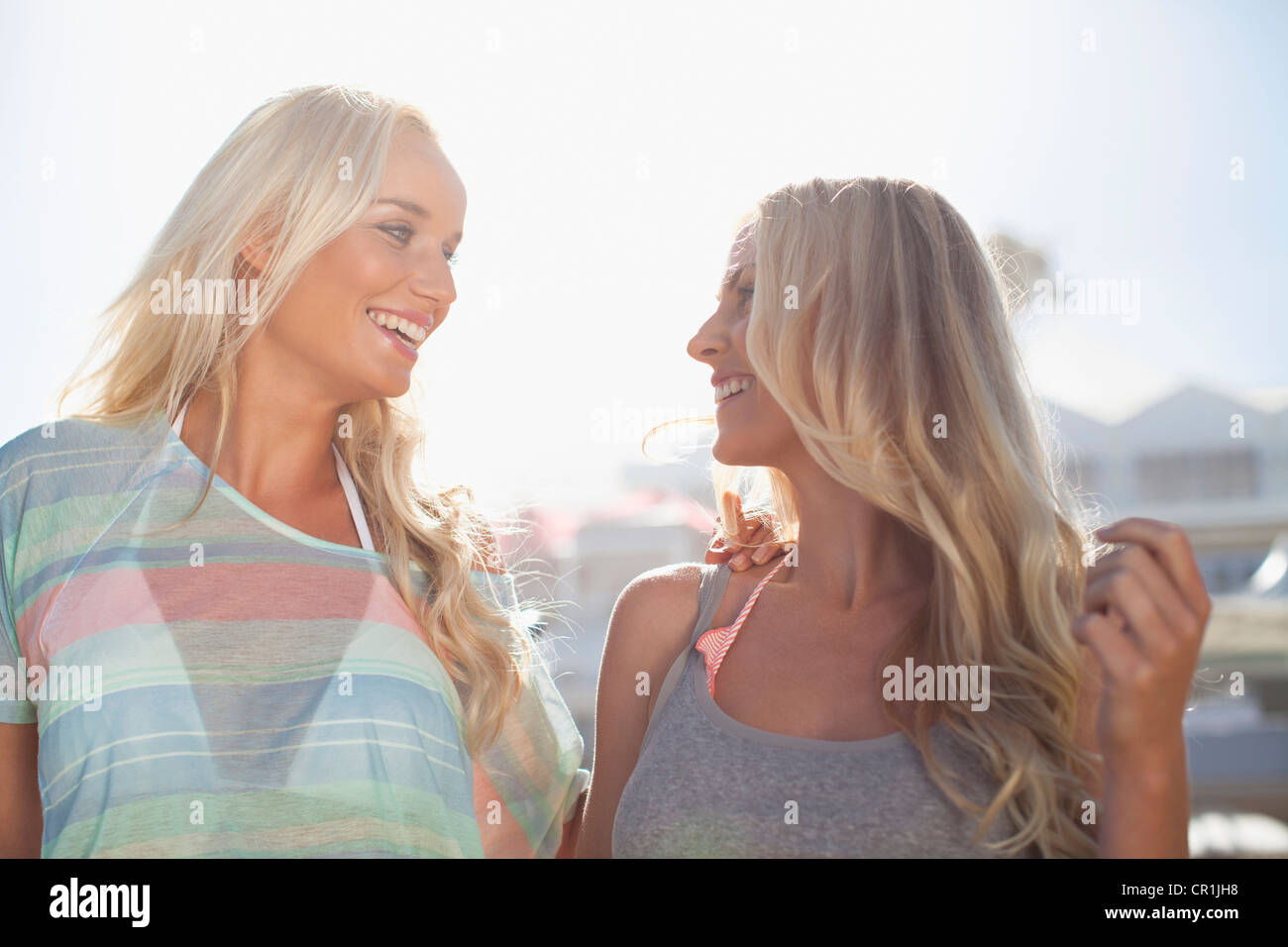 Smiling women walking together outdoors Stock Photo - Alamy