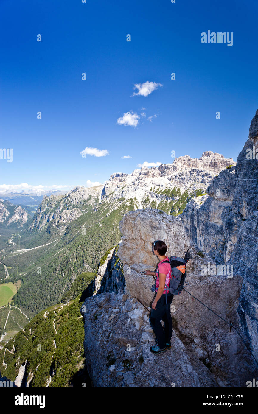 Female mountaineer during the ascent to Monte Piano, fixed rope route ...