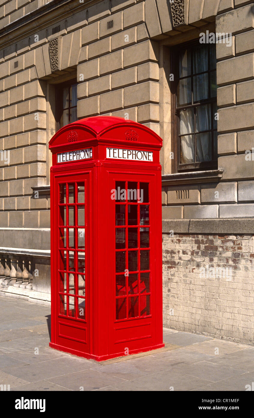 Red London telephone box, newly painted, Central London Stock Photo - Alamy