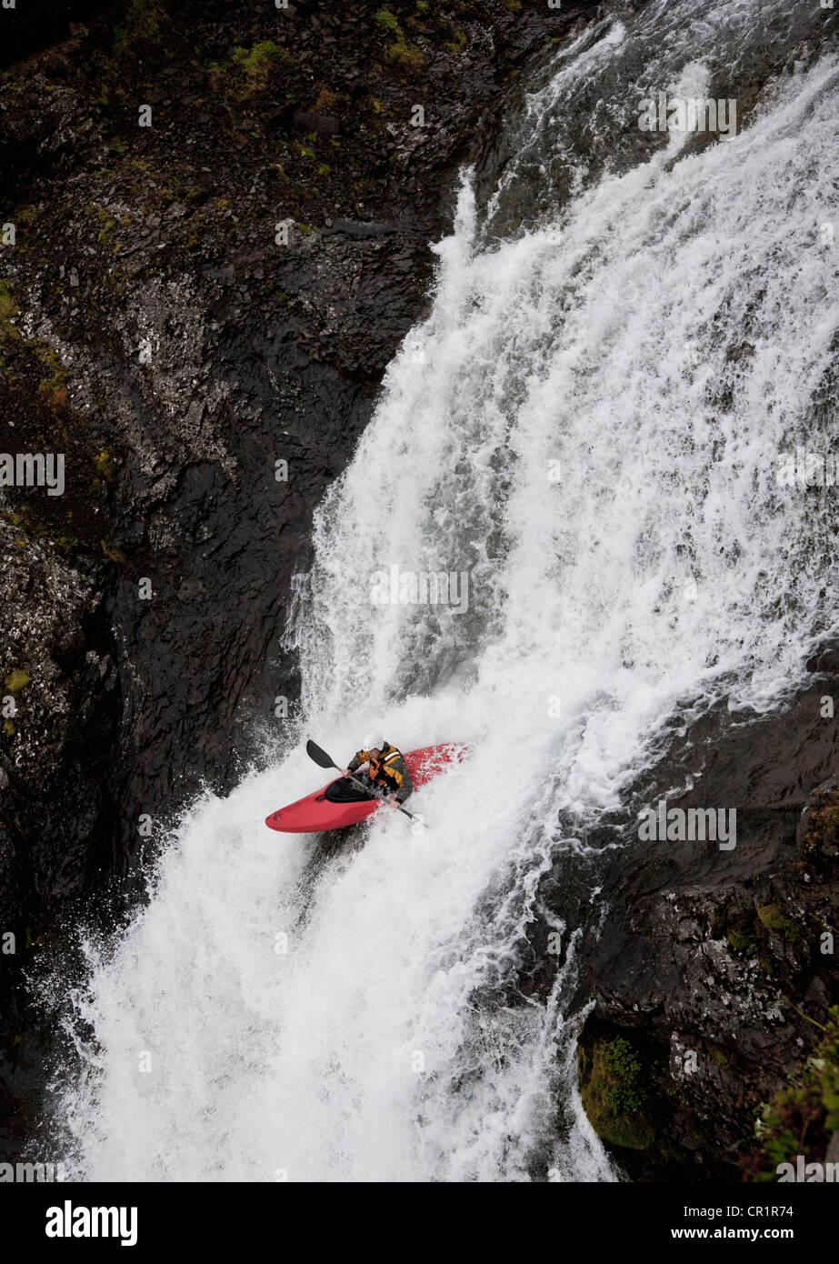 Man canoeing over rocky waterfall Stock Photo - Alamy