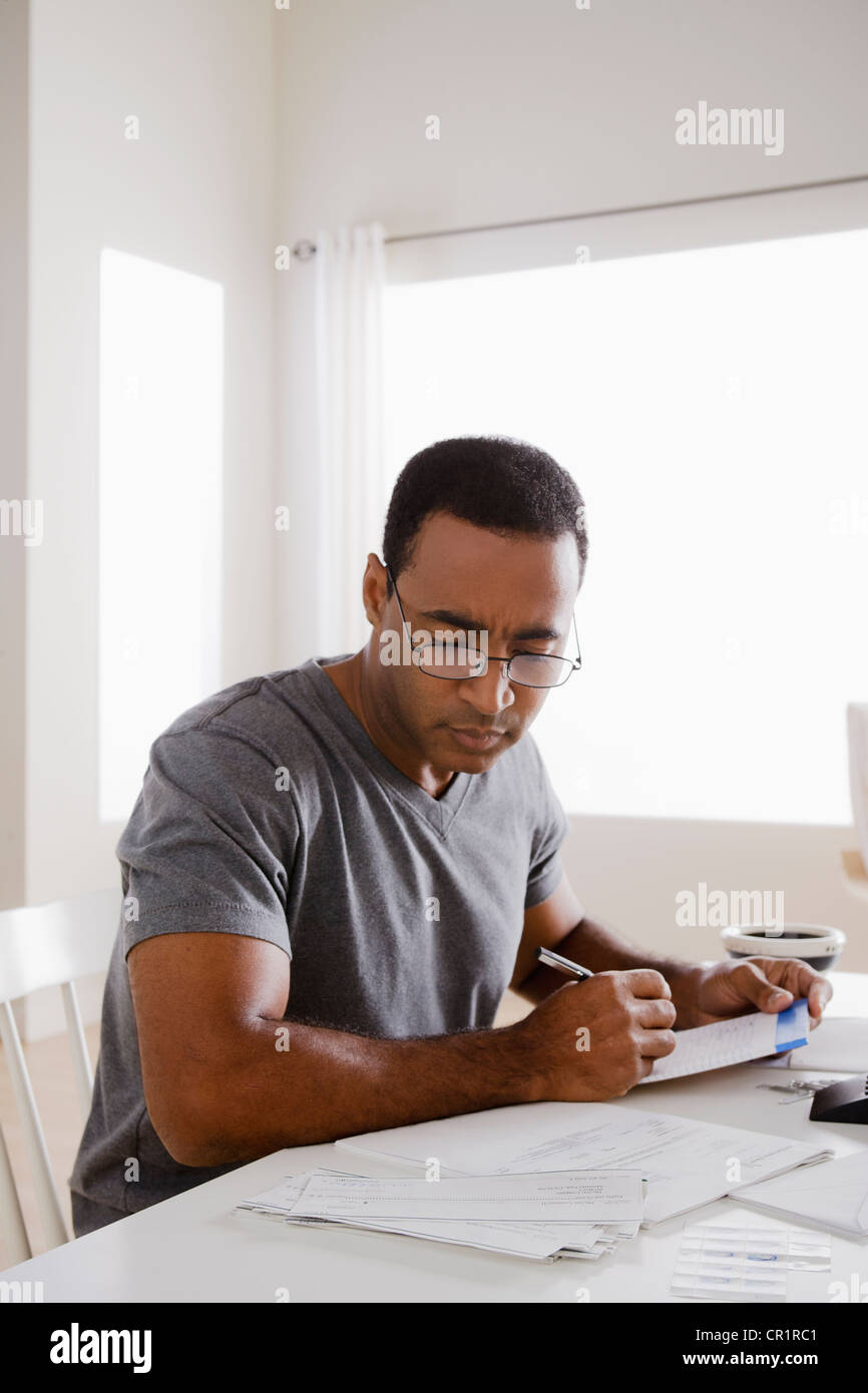 USA, California, Los Angeles, Mature man using calculator Stock Photo ...