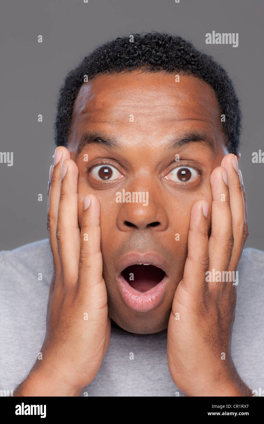 Shocked man in black hi-res stock photography and images - Alamy