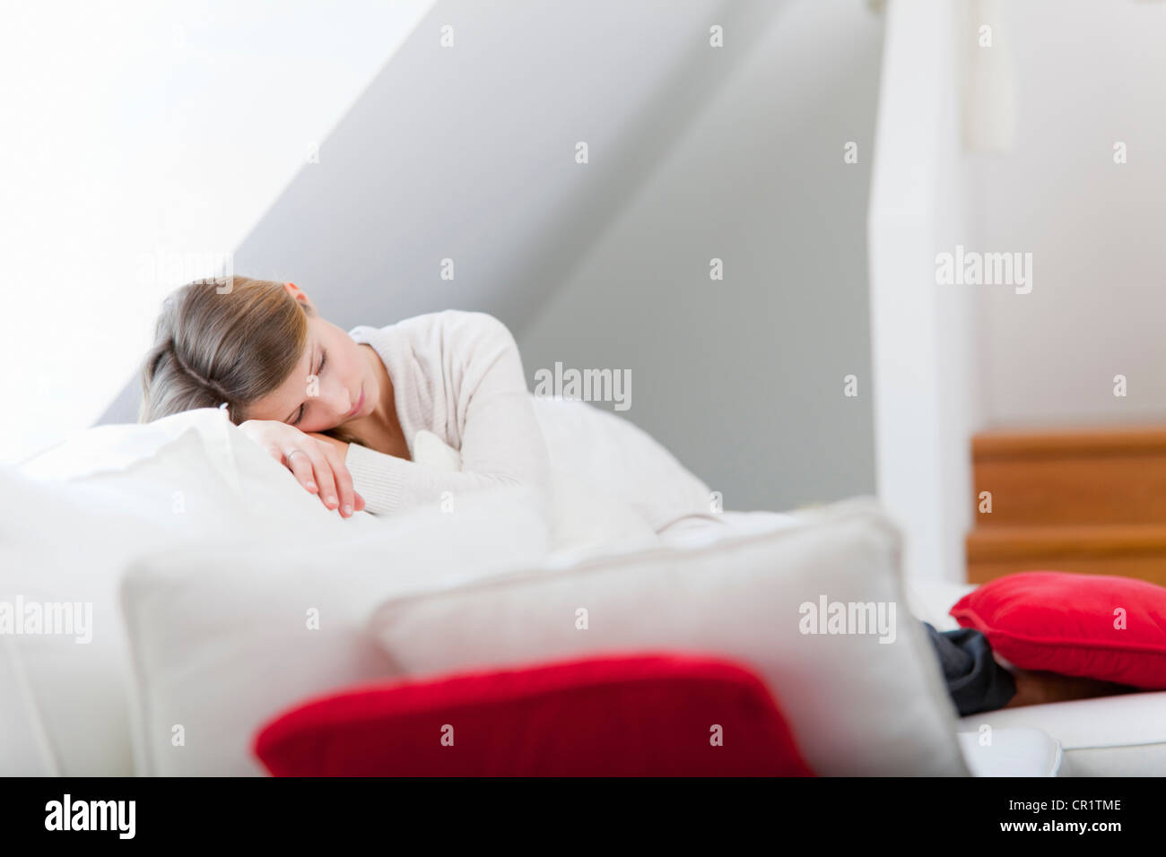 Woman leaning on couch hi-res stock photography and images - Alamy