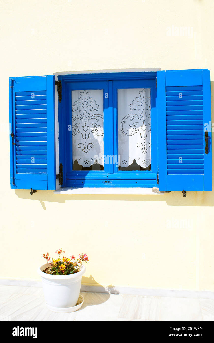 Old Greek traditional house with blue window in Santorini island ...