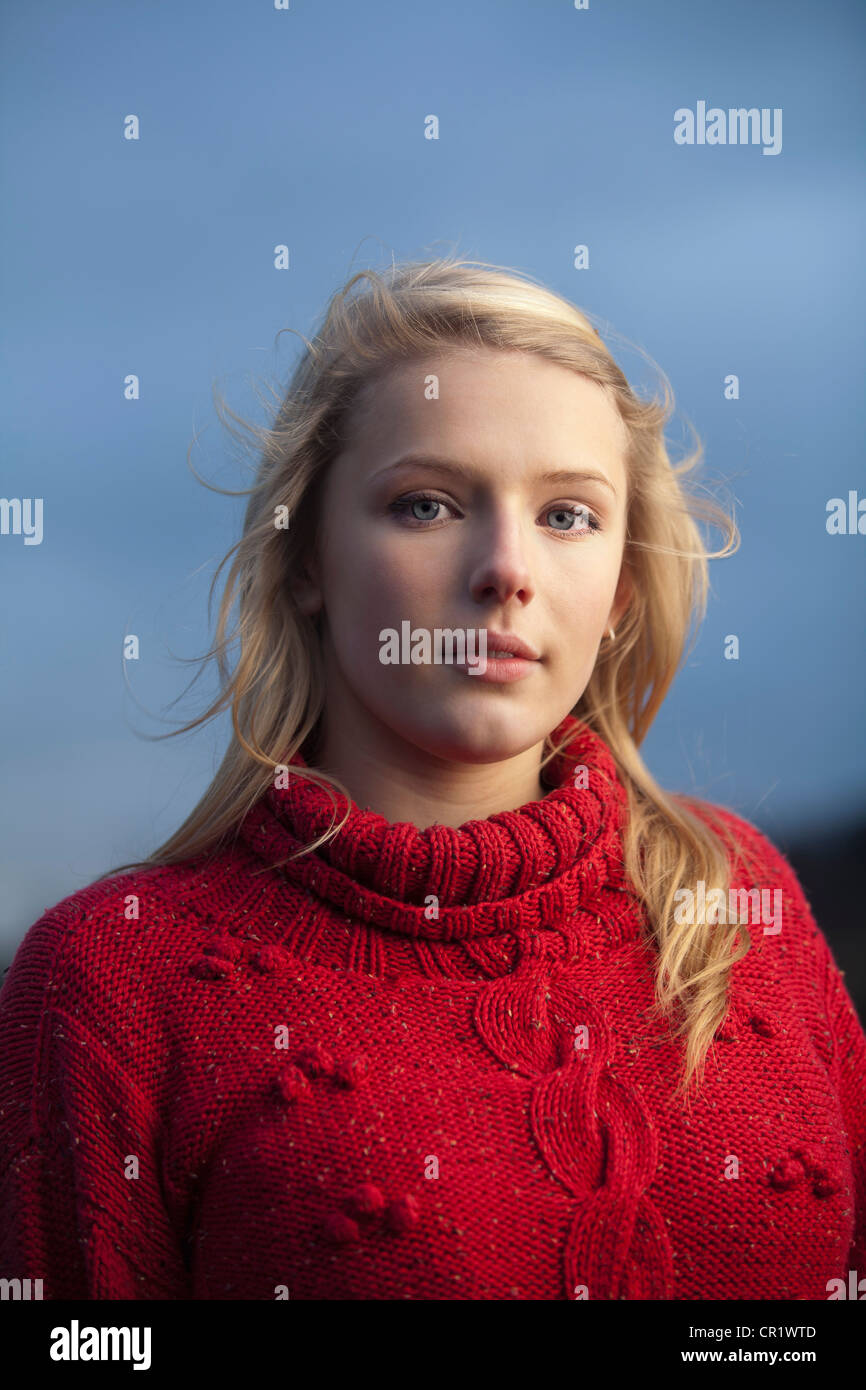 Teenage girl wearing sweater outdoors Stock Photo - Alamy