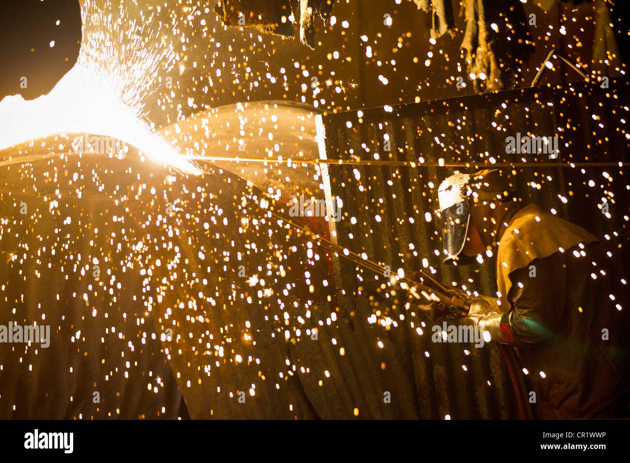 Welder at work in steel forge Stock Photo - Alamy