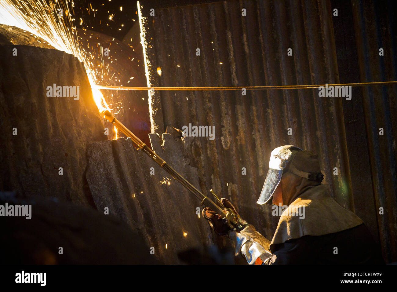 Welder at work in steel forge Stock Photo - Alamy
