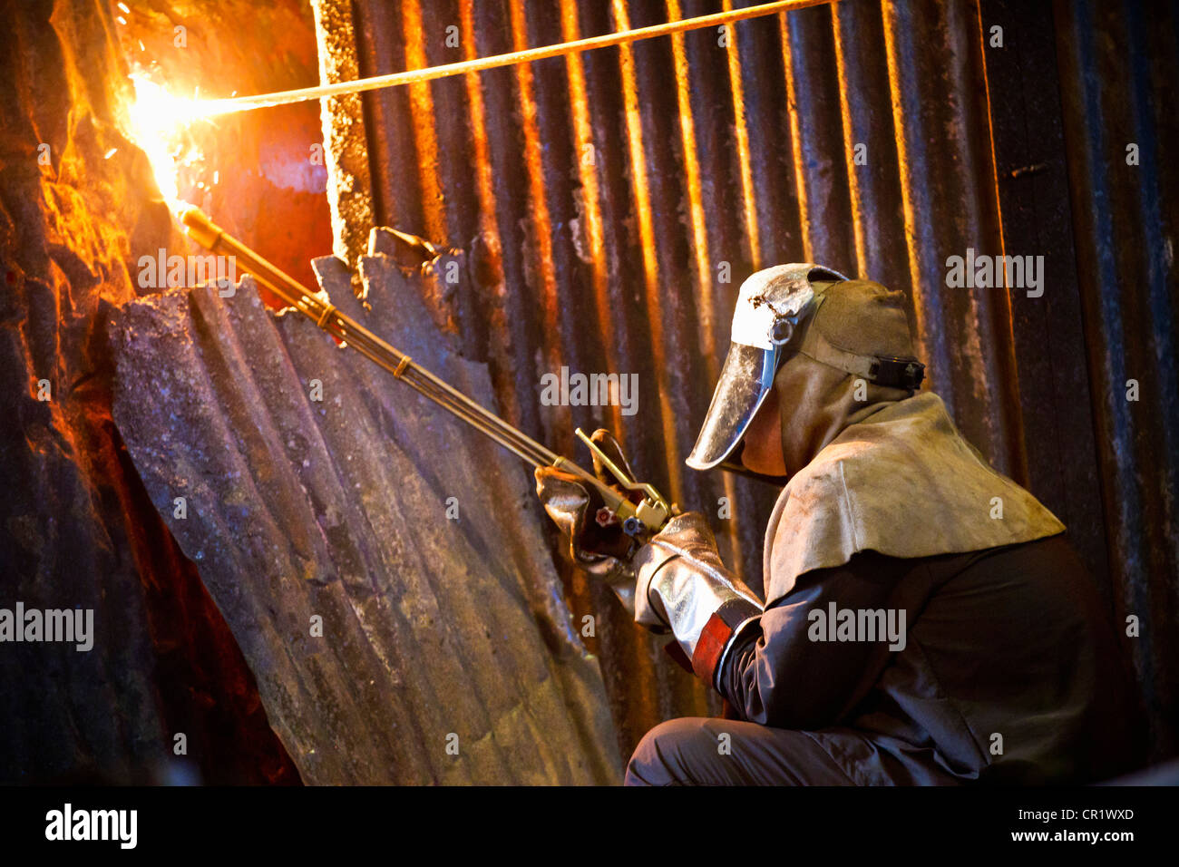 Welder at work in steel forge Stock Photo - Alamy
