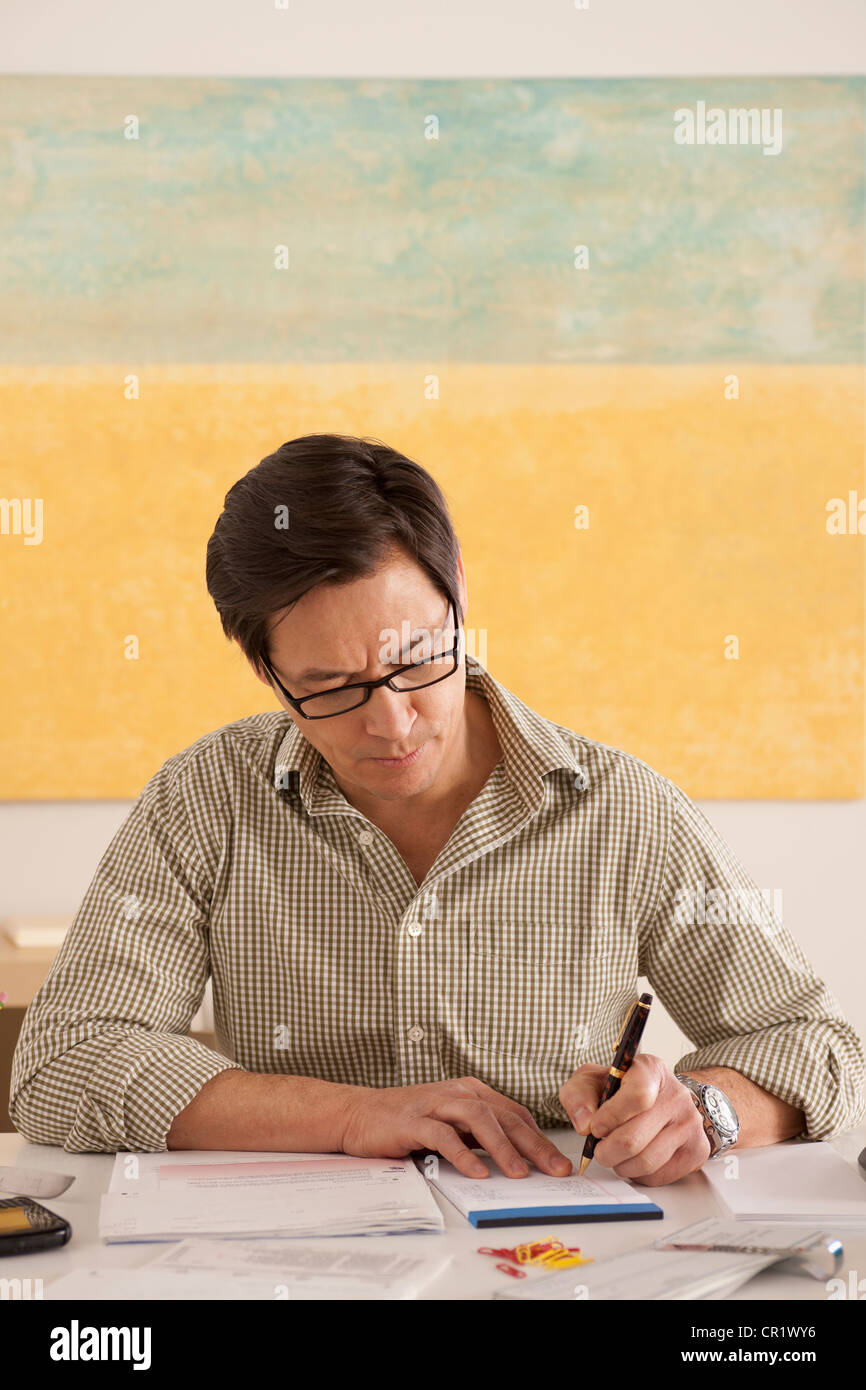 USA, California, Los Angeles, Man doing paperwork Stock Photo - Alamy