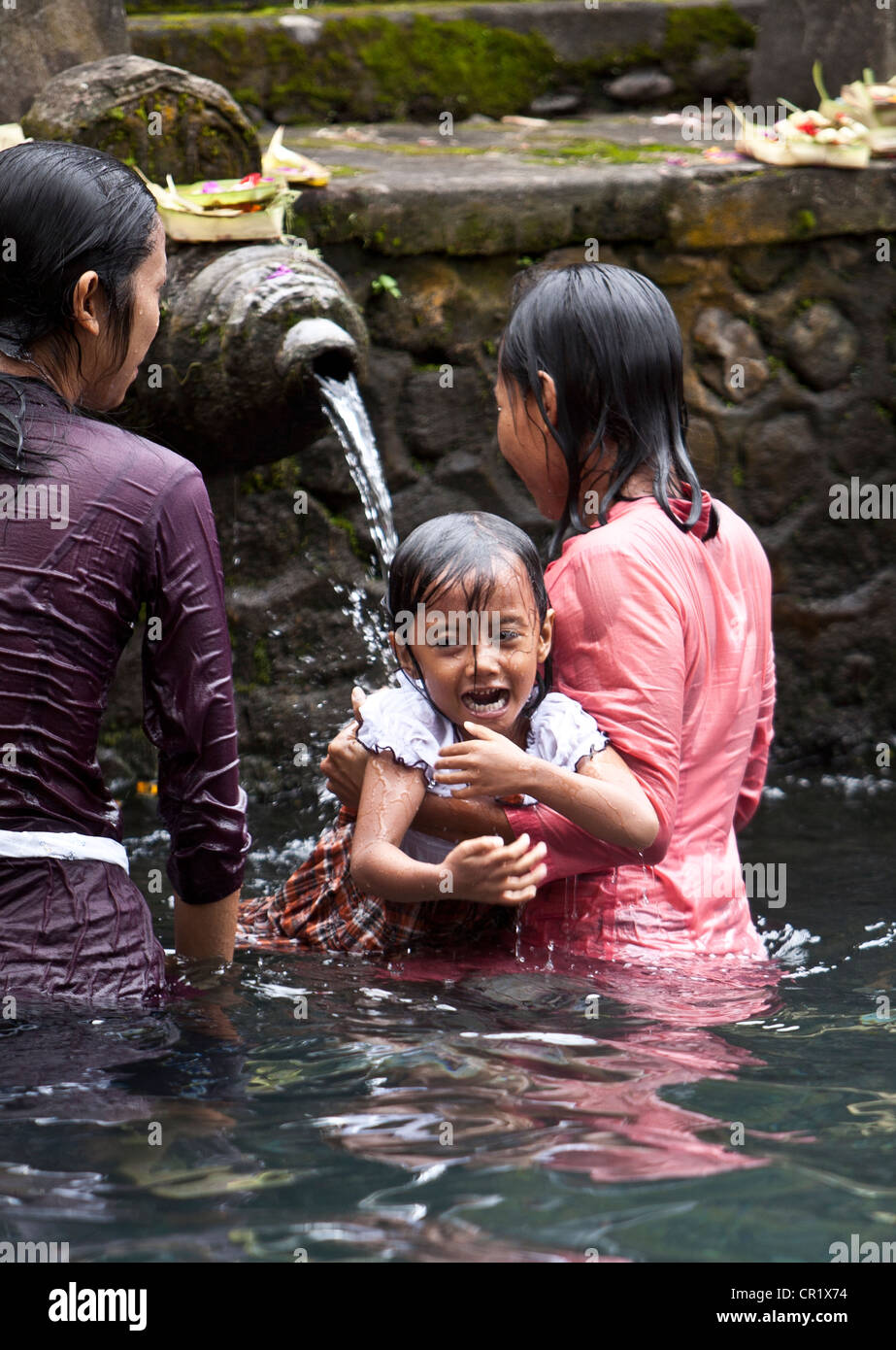 A child being immersed in holy water Stock Photo - Alamy