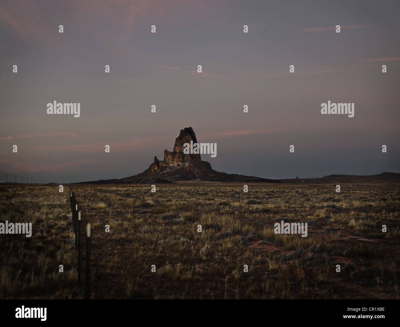 Rock formation in grassy desert Stock Photo - Alamy