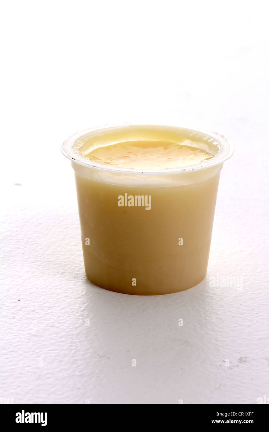 Vanilla pudding in a cup on white background Stock Photo - Alamy