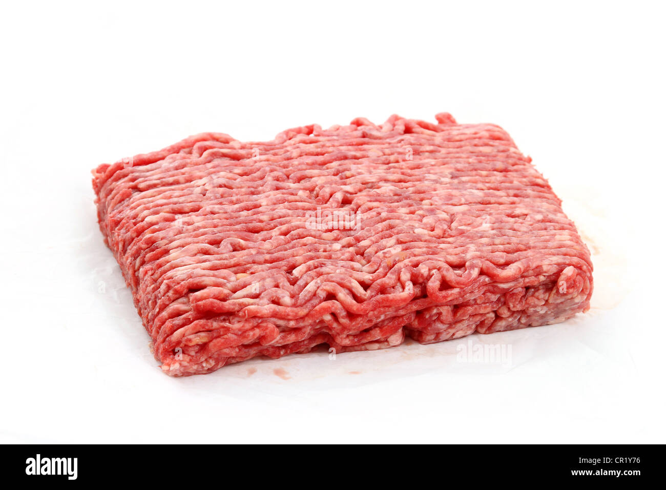 Raw pile of ground beef on white background Stock Photo - Alamy