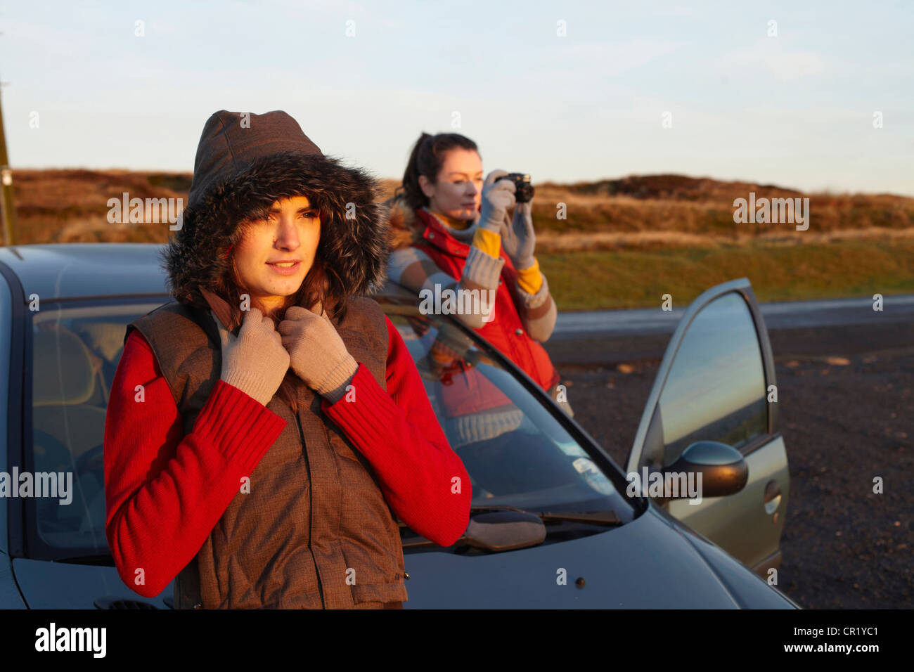 Women admiring landscape from roadside Stock Photo - Alamy