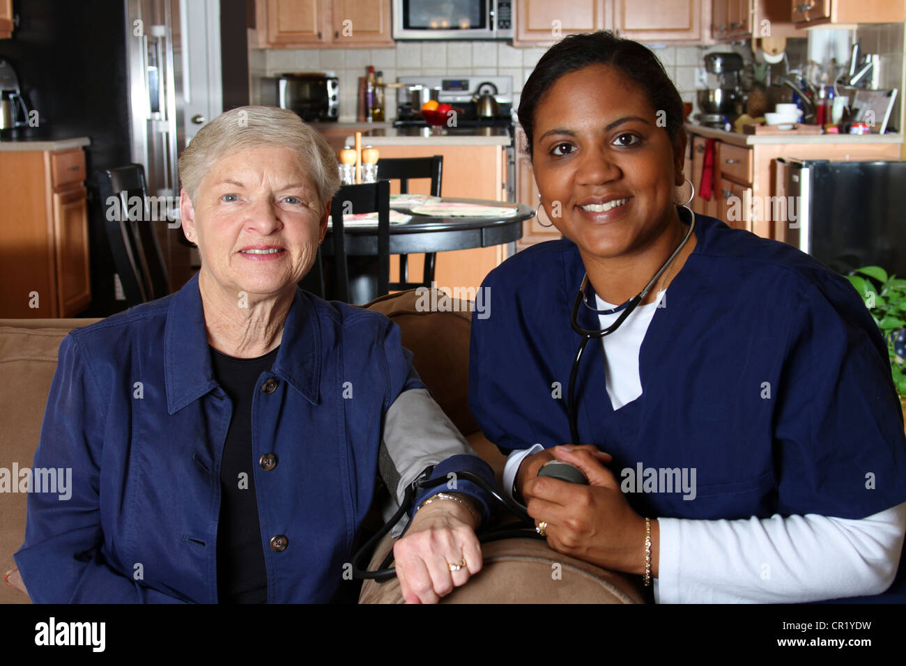 Home health care worker and a senior woman Stock Photo - Alamy