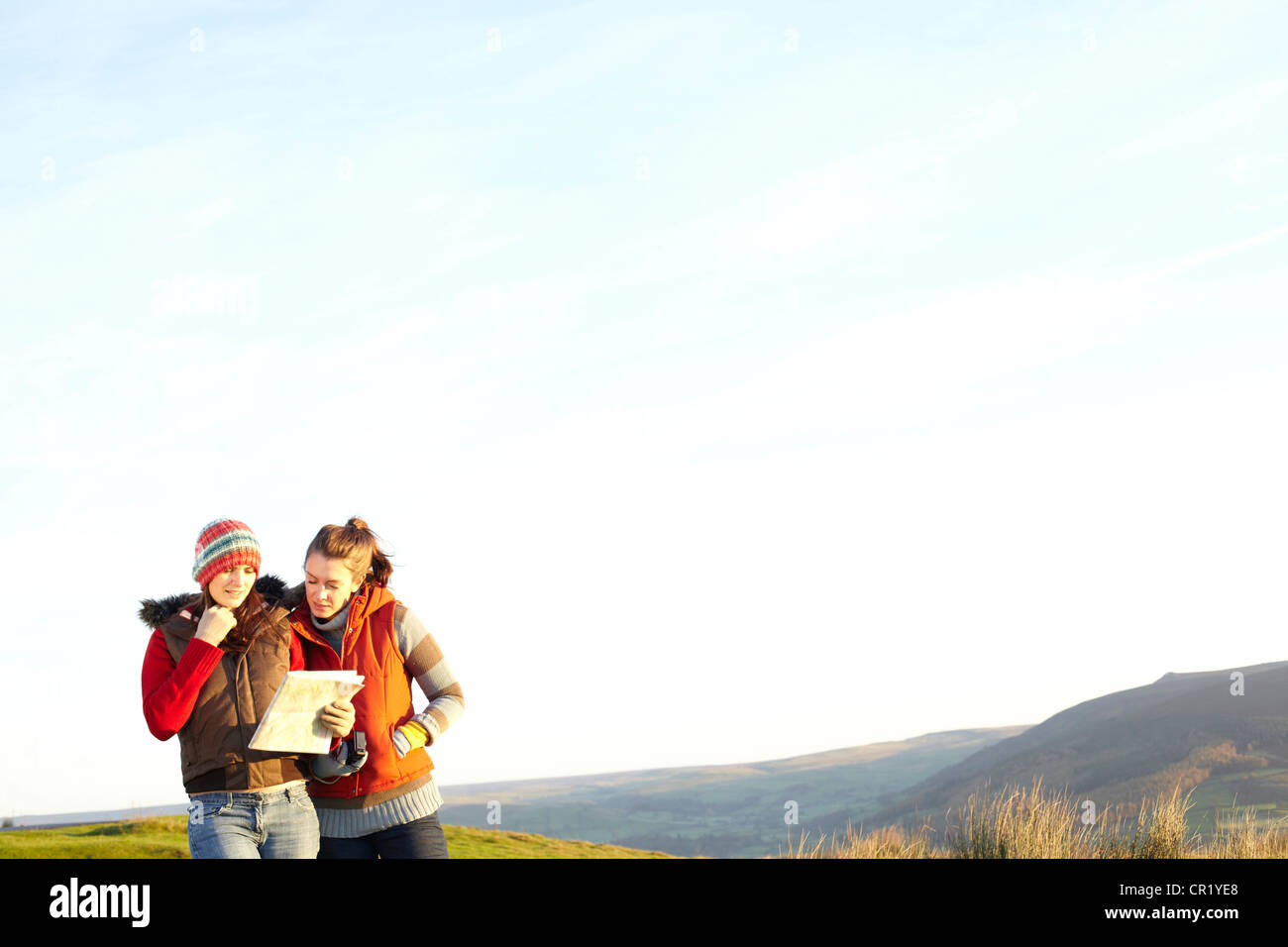 Women reading map outdoors Stock Photo - Alamy