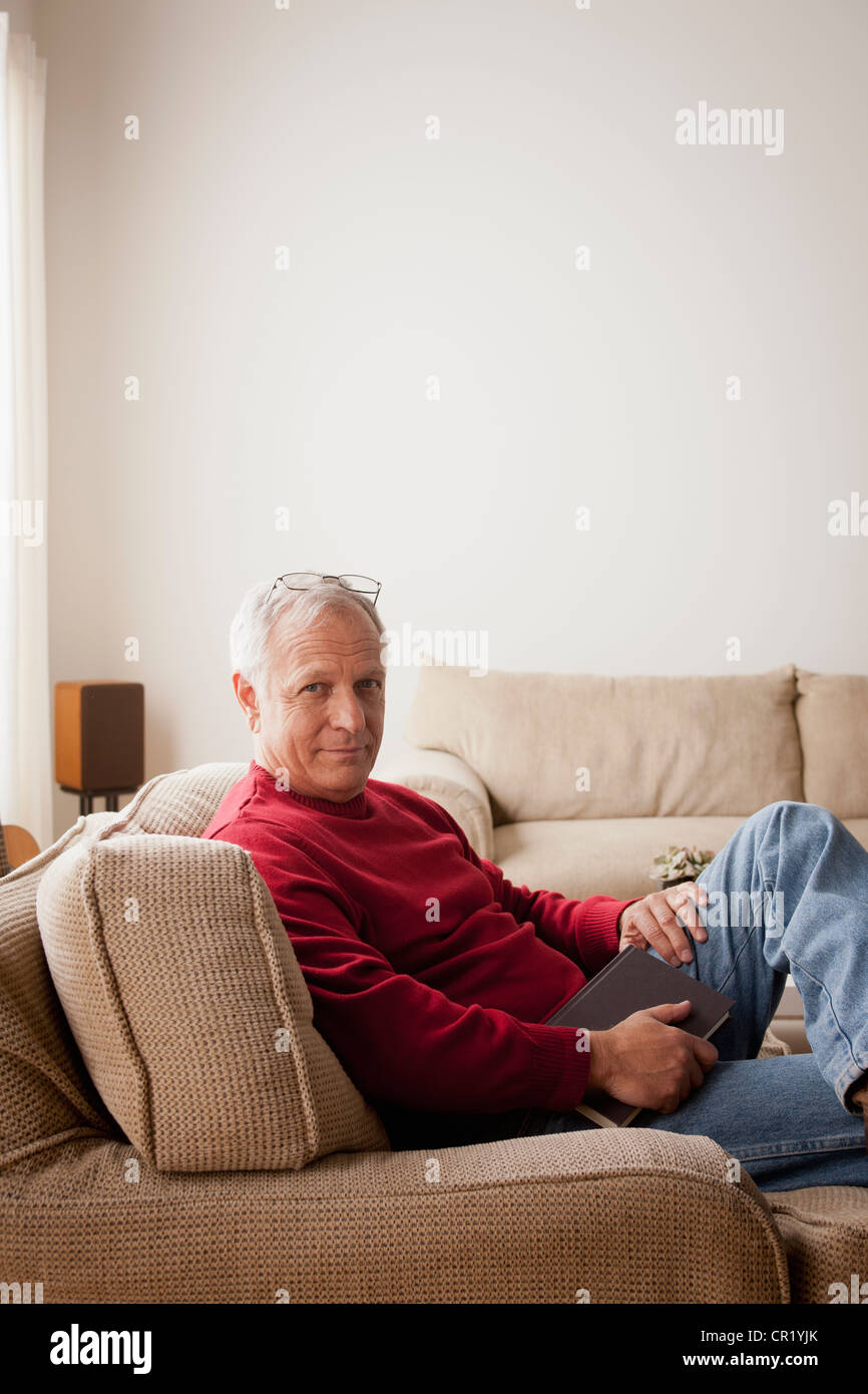 USA, California, Los Angeles, Portrait of senior man sitting in ...