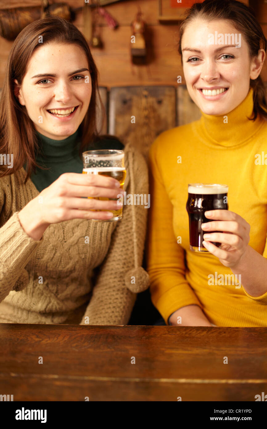 Women drinking beer in pub Stock Photo - Alamy