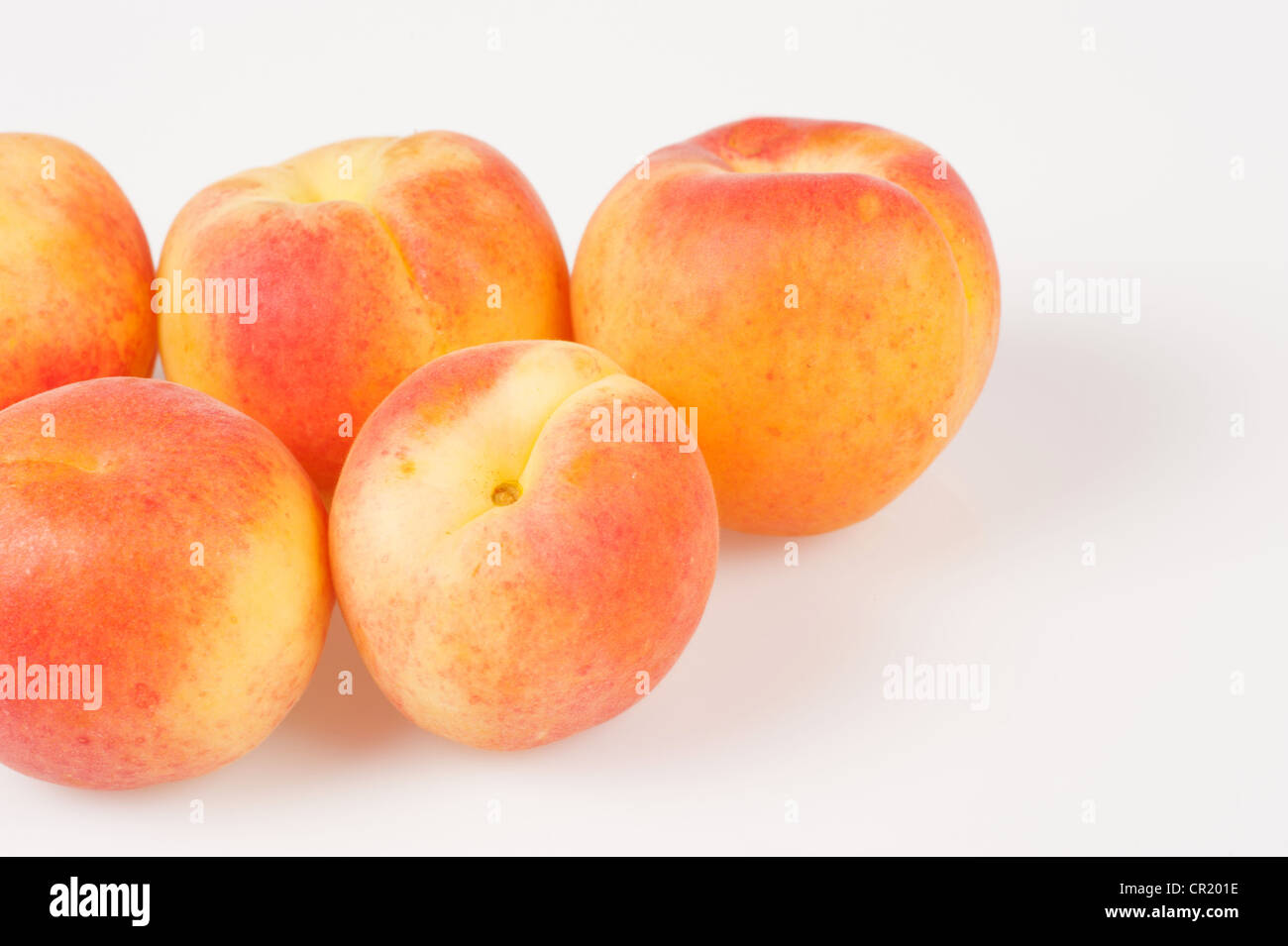 Several ripe apricots isolated on white background Stock Photo - Alamy