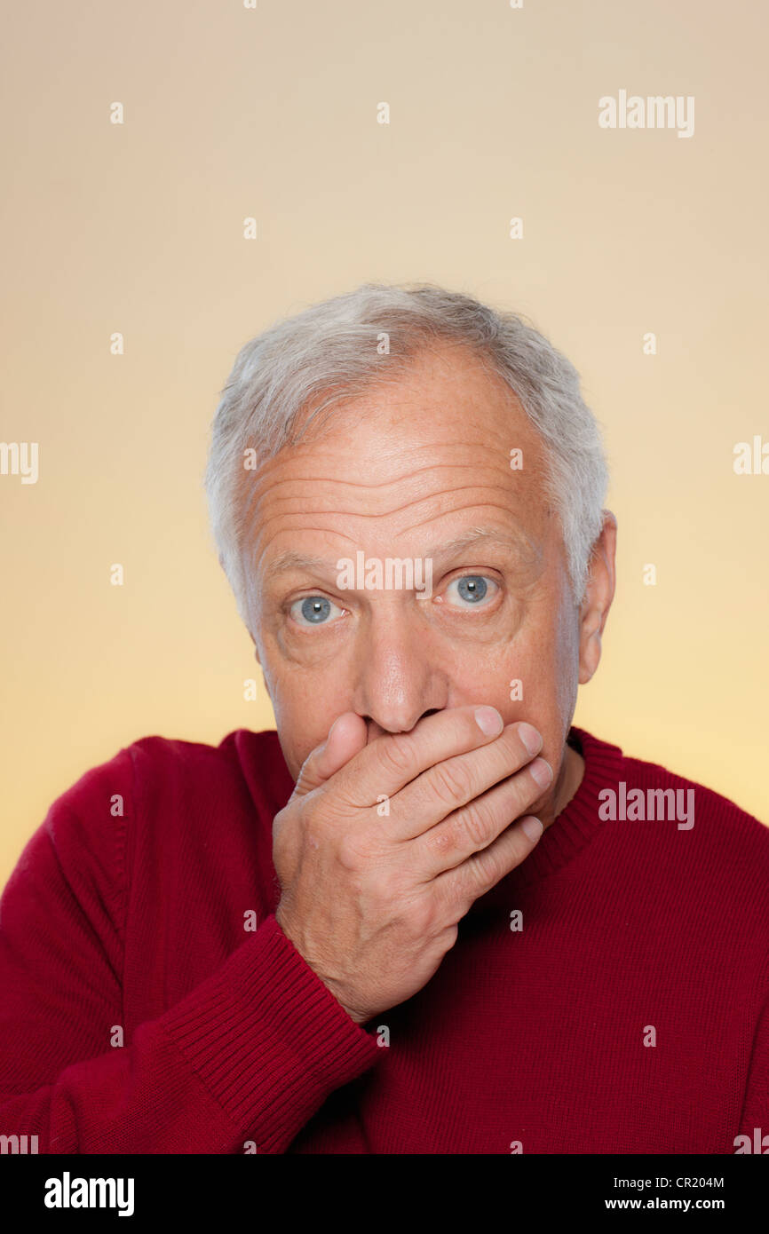 Embarrassed senior man covering hi-res stock photography and images - Alamy