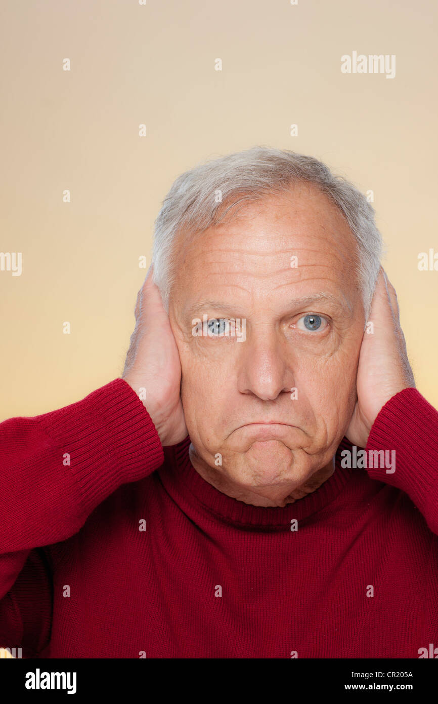Embarrassed senior man covering hi-res stock photography and images - Alamy