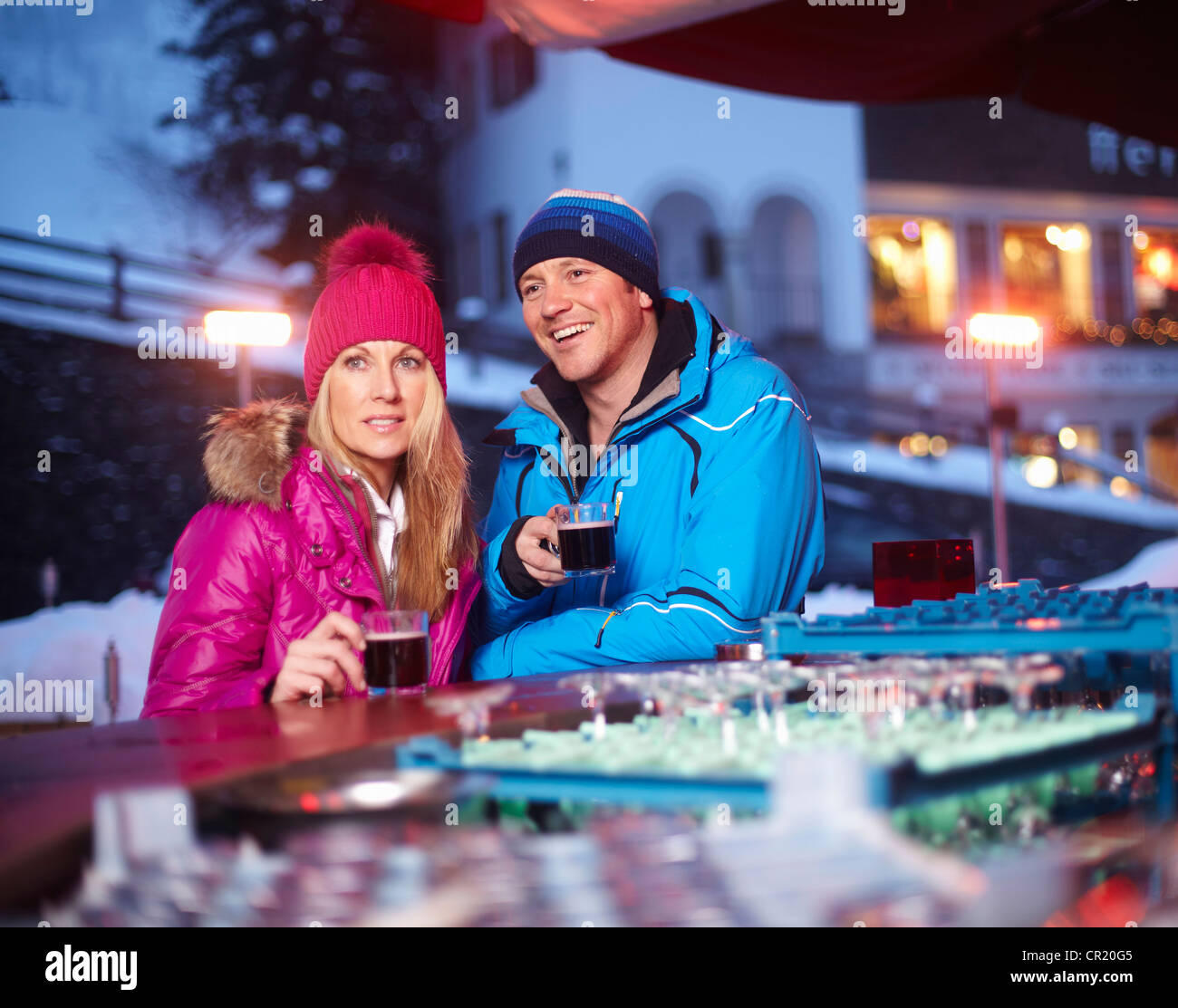 Couple having coffee outdoors in winter Stock Photo - Alamy