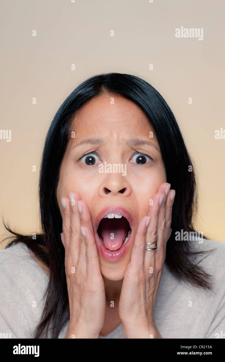 Portrait of woman with astonished expression Stock Photo - Alamy