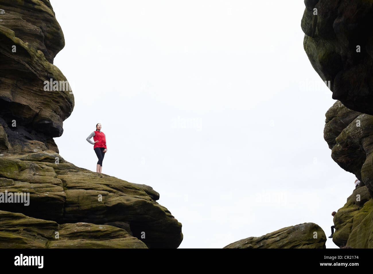 Woman standing on rock formations Stock Photo - Alamy
