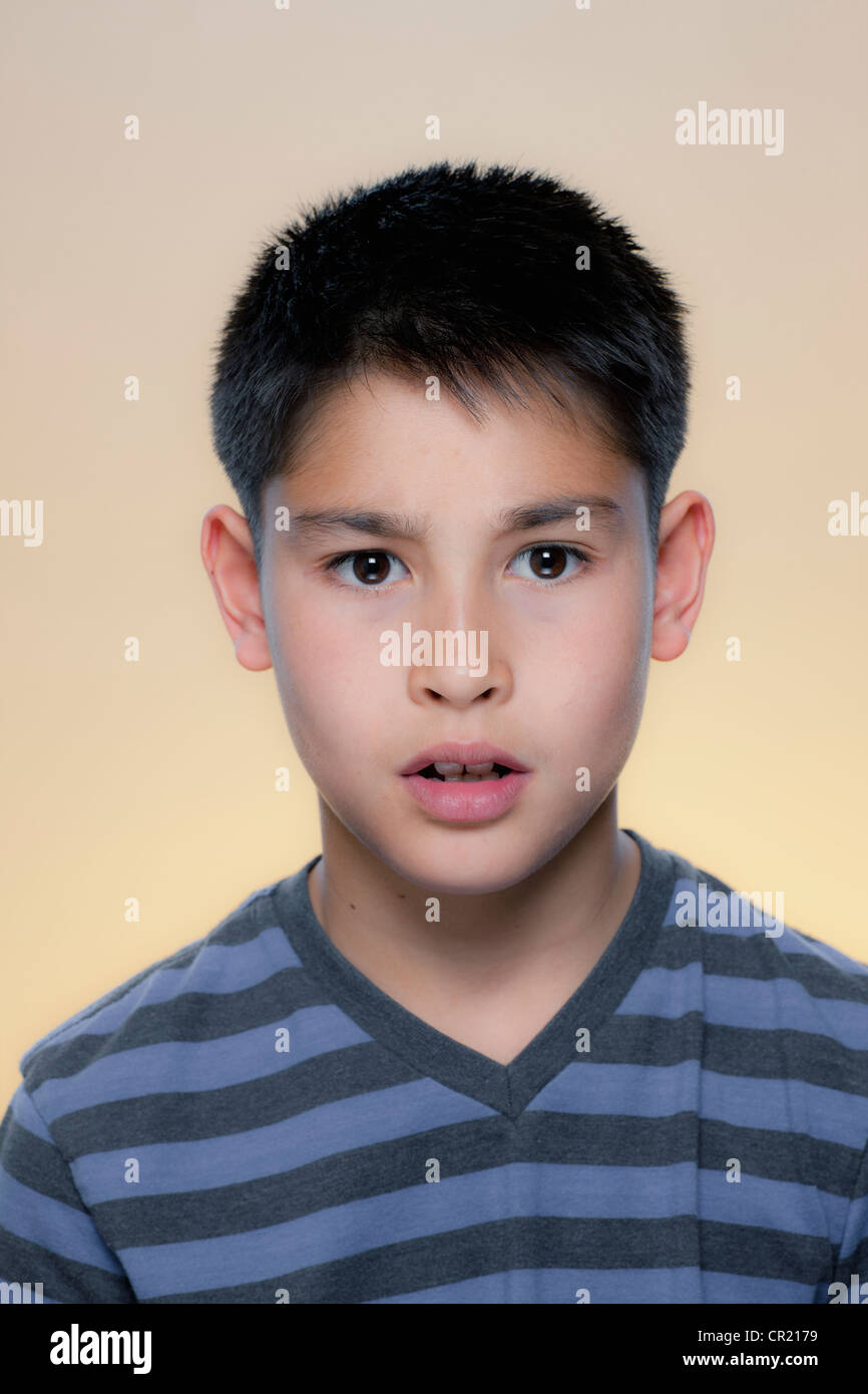 Portrait of boy with concerned expression Stock Photo - Alamy