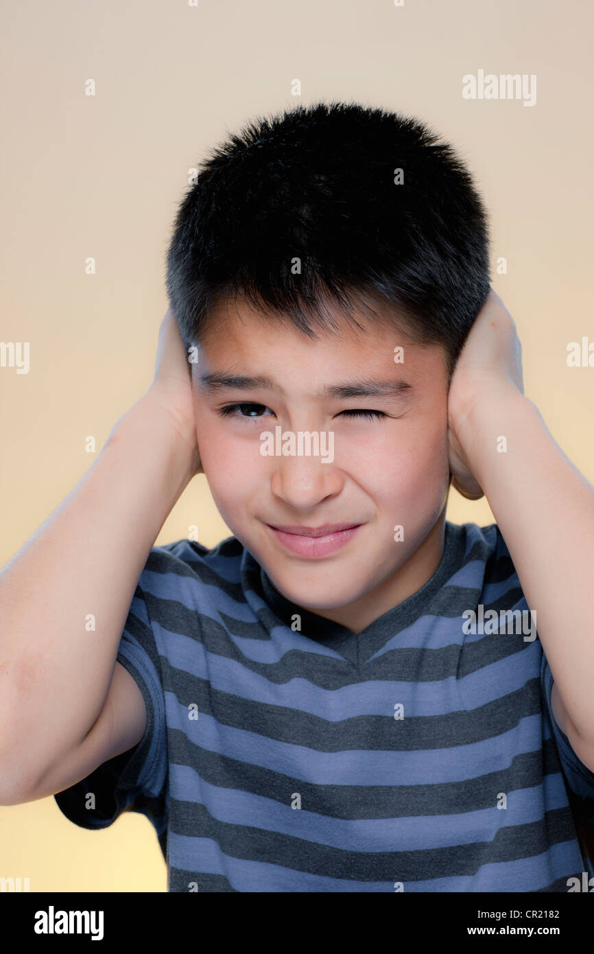 Portrait of boy making displeased expression Stock Photo - Alamy