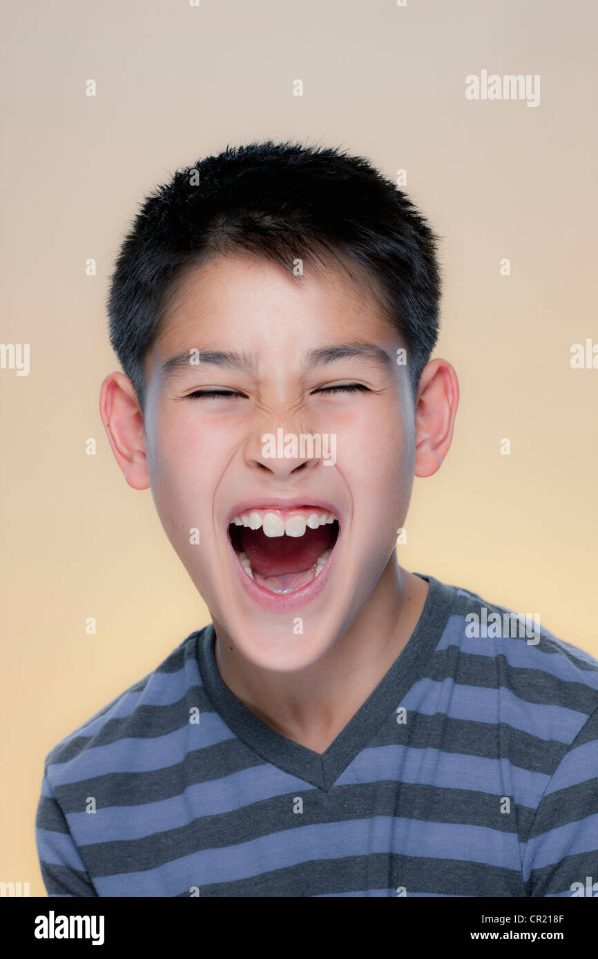 Portrait of laughing boy Stock Photo - Alamy