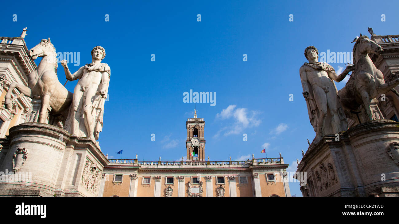 Ancient statues and clock tower Stock Photo - Alamy