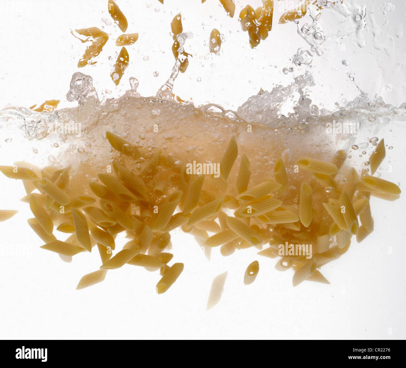 Pasta splashing in water Stock Photo - Alamy