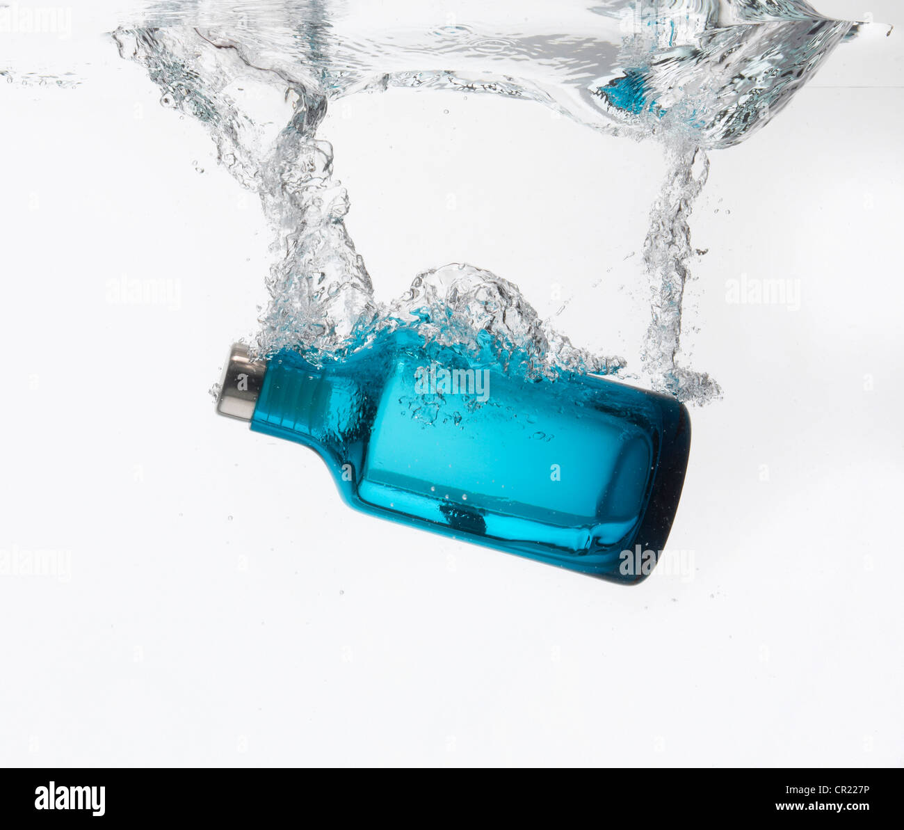Bottle splashing in water Stock Photo - Alamy