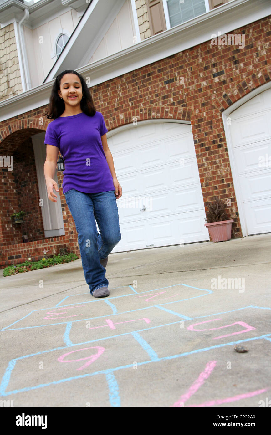Child playing hopscotch outside at her home Stock Photo - Alamy