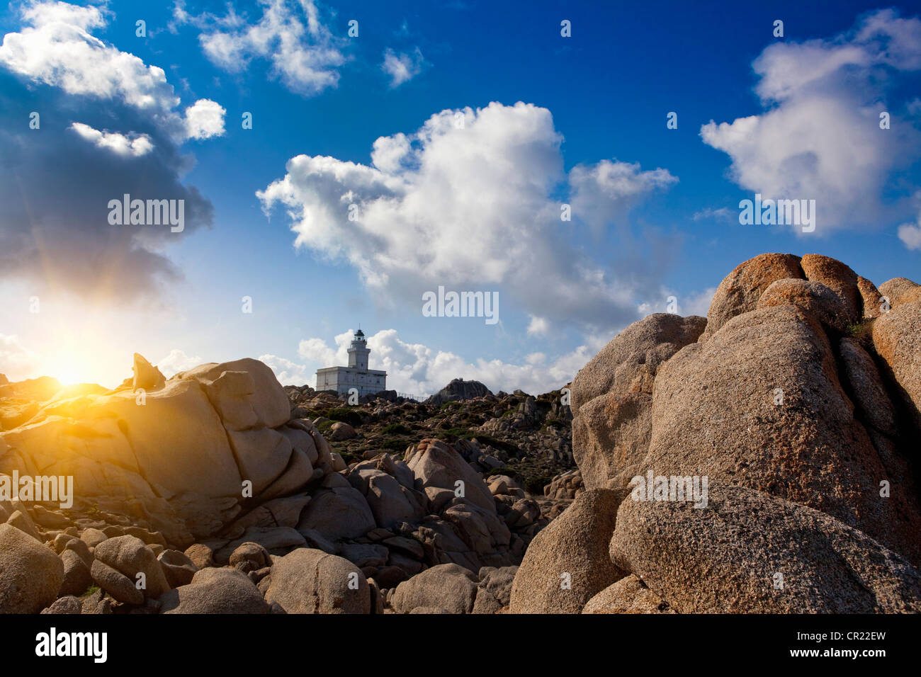 Lighthouse on rocky coastline Stock Photo - Alamy