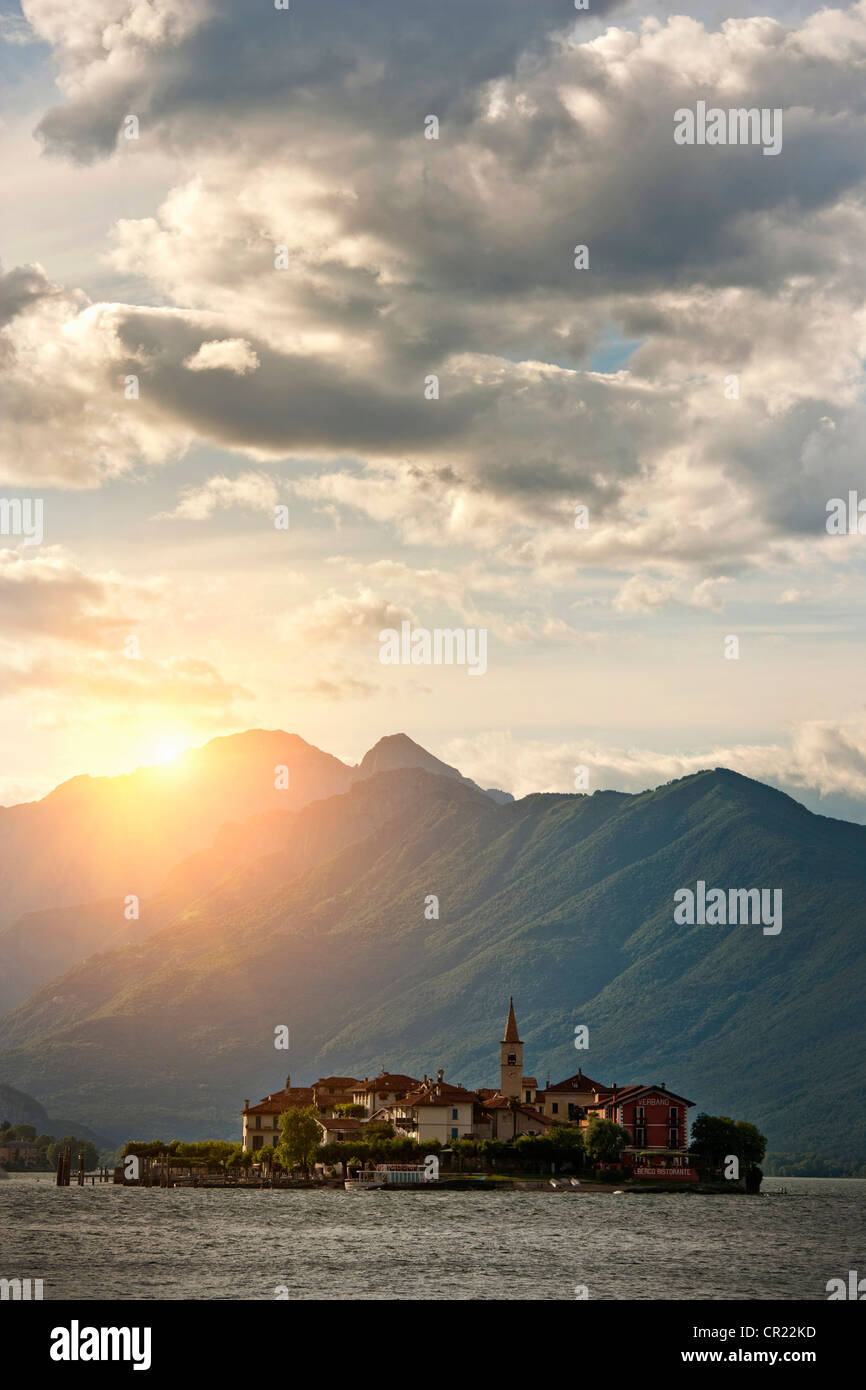 Sun shining over castle built on island Stock Photo - Alamy