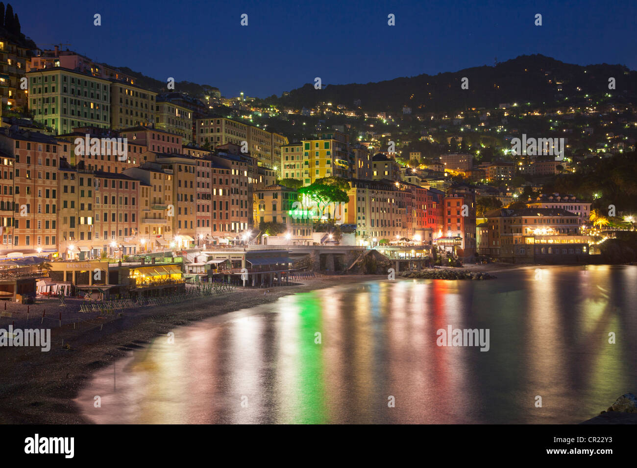 Urban coastline lit up at night Stock Photo - Alamy