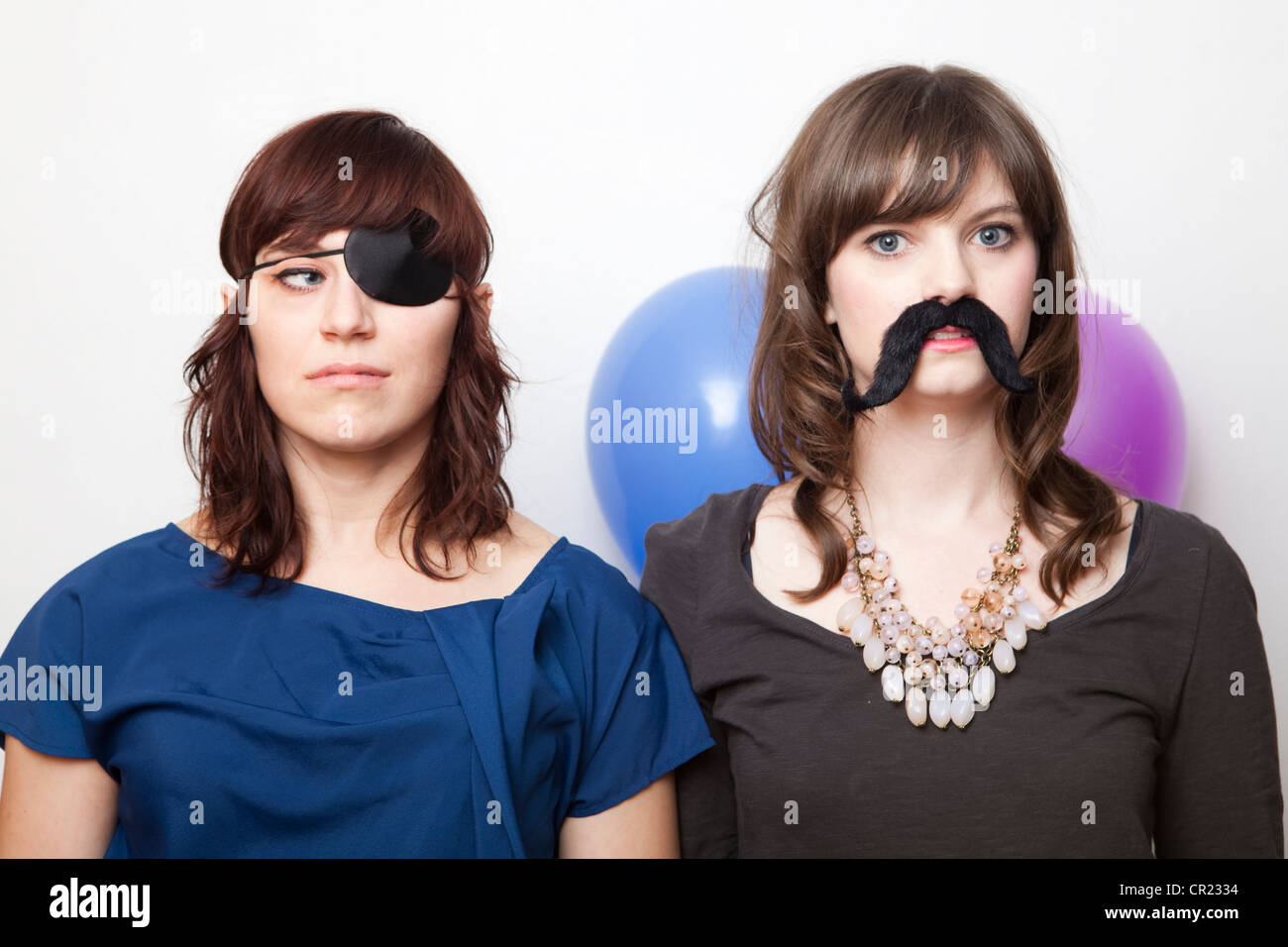Studio Shot of dressed up young women Stock Photo - Alamy