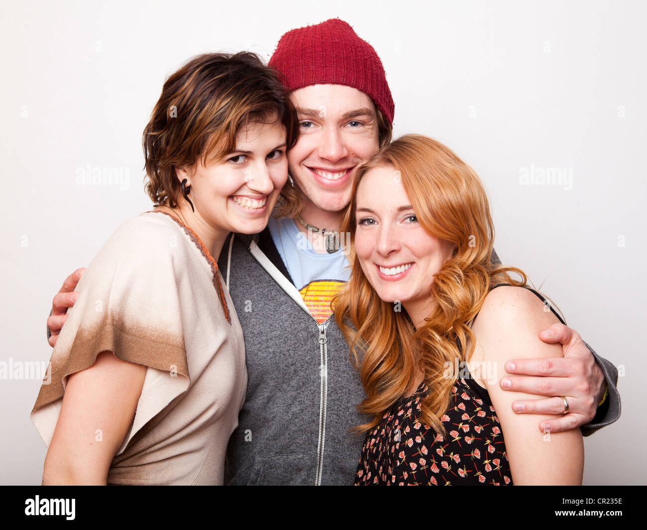Studio Shot portrait of three people smiling Stock Photo - Alamy