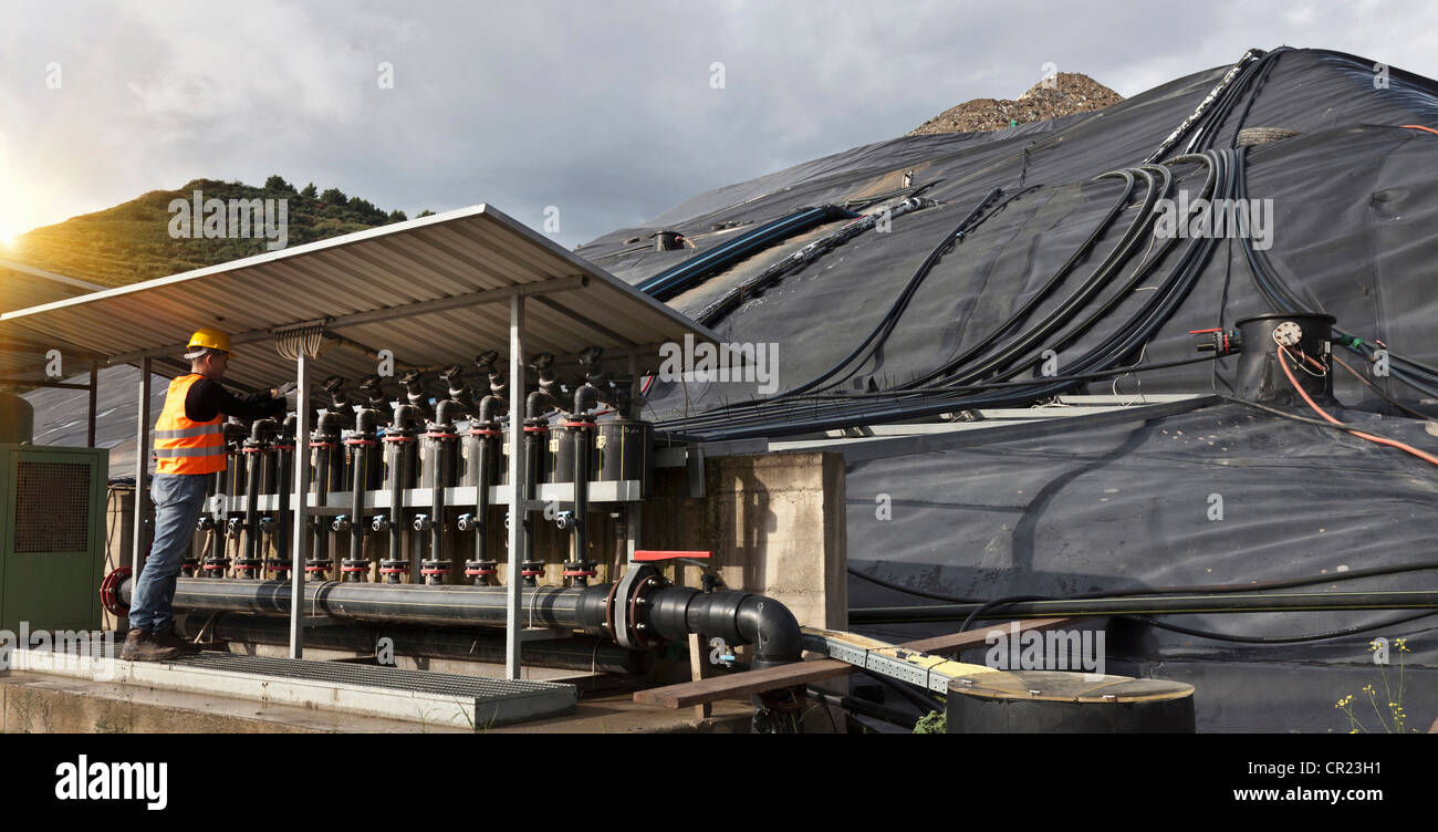 Worker at garbage collection center Stock Photo - Alamy