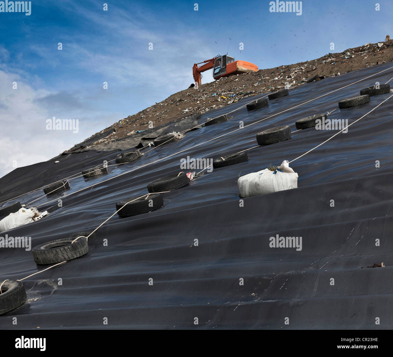 Digger at garbage collection center Stock Photo - Alamy