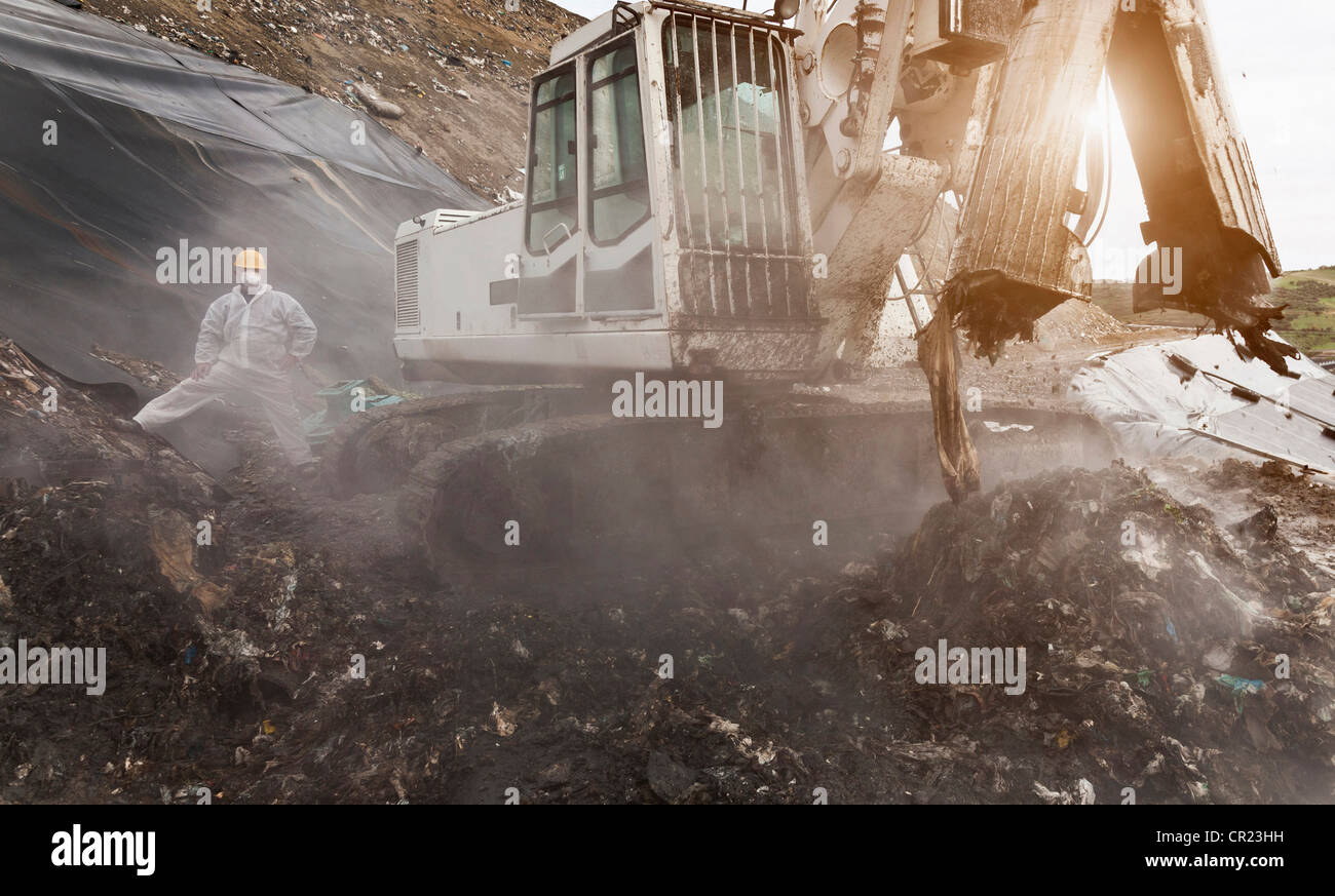 Digger at garbage collection center Stock Photo - Alamy