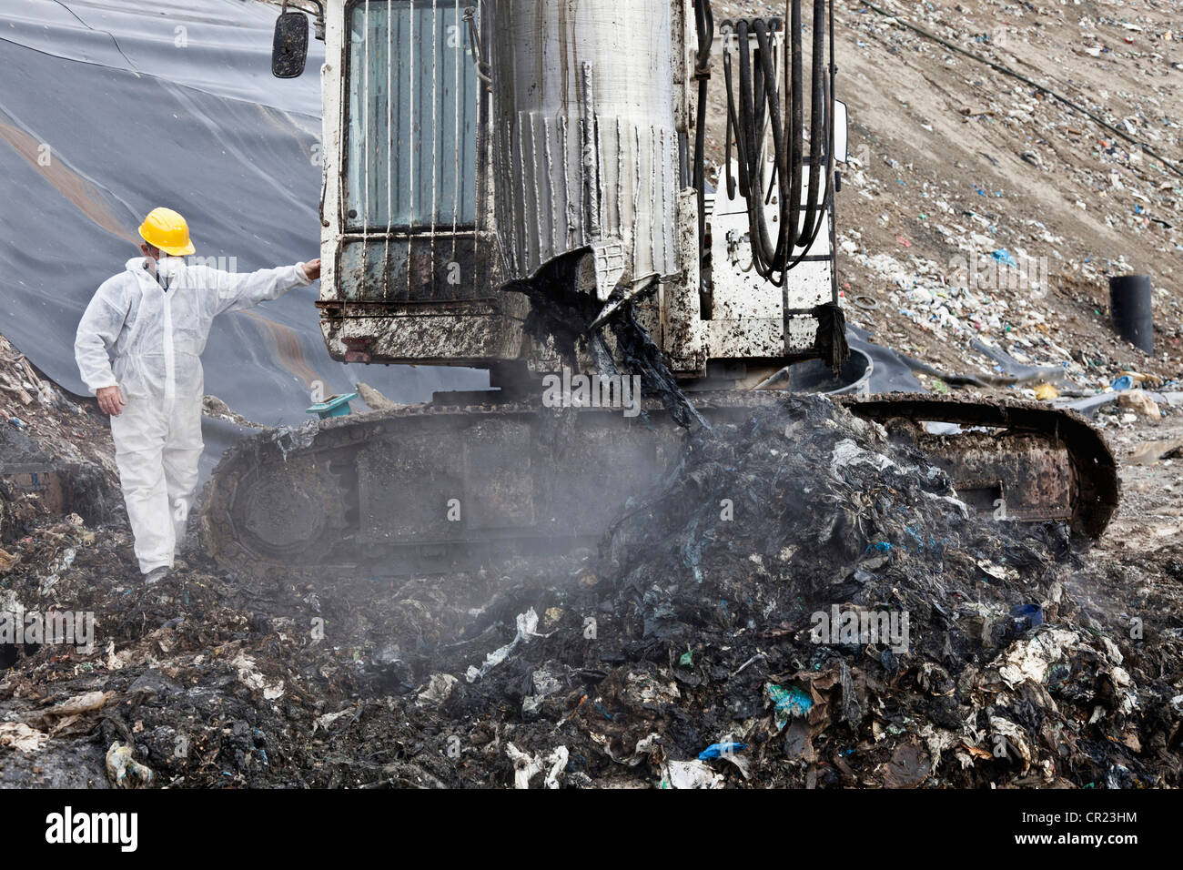 Worker at garbage collection center Stock Photo - Alamy