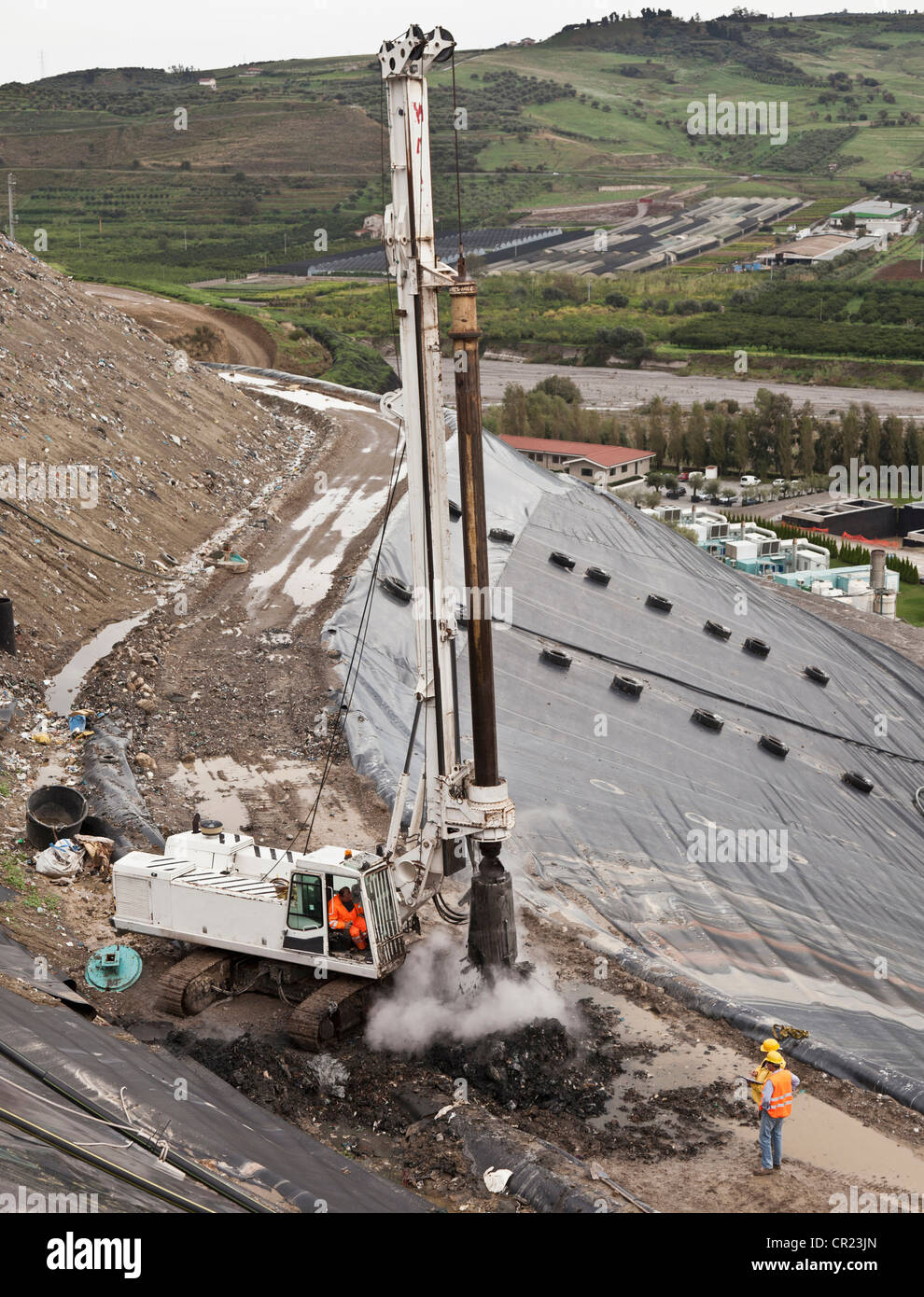 Crane at garbage collection center Stock Photo - Alamy