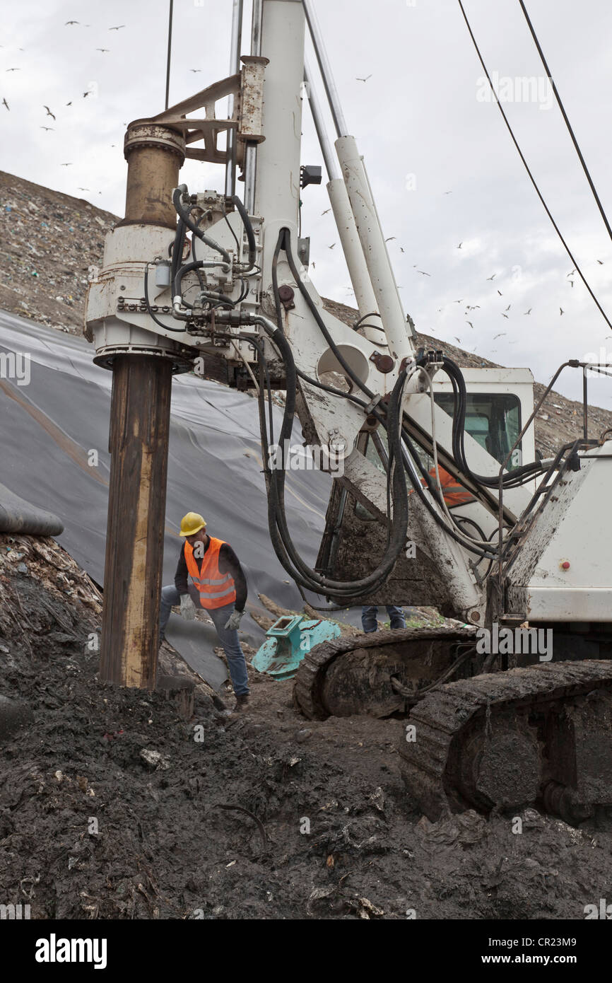 Worker at garbage collection center Stock Photo - Alamy