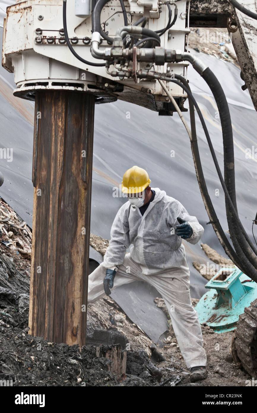 Worker at garbage collection center Stock Photo - Alamy