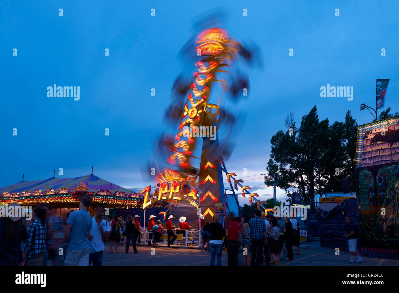 Carnival rides at dusk hi-res stock photography and images - Alamy