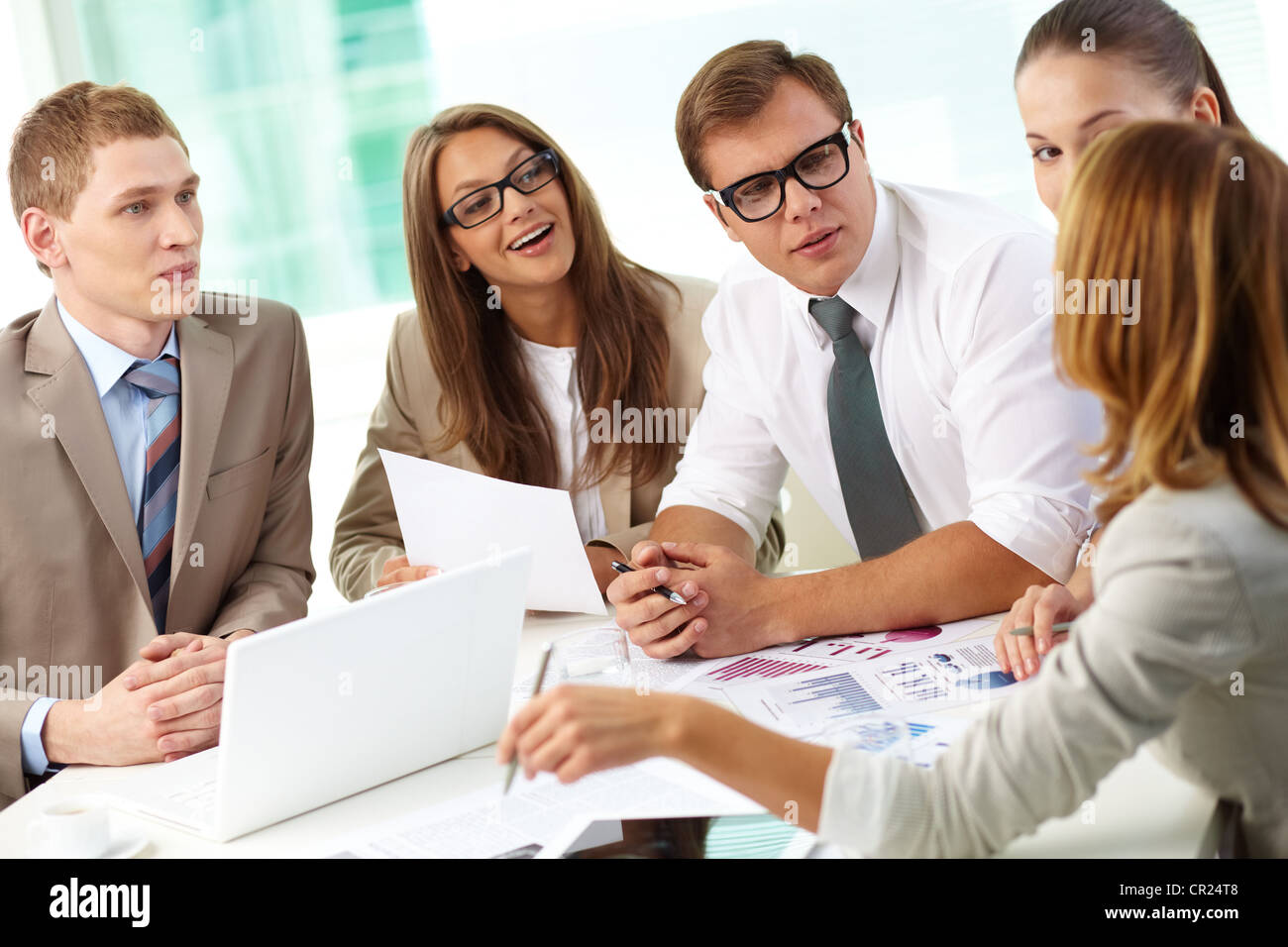 Female team member expressing her business ideas to her colleagues ...