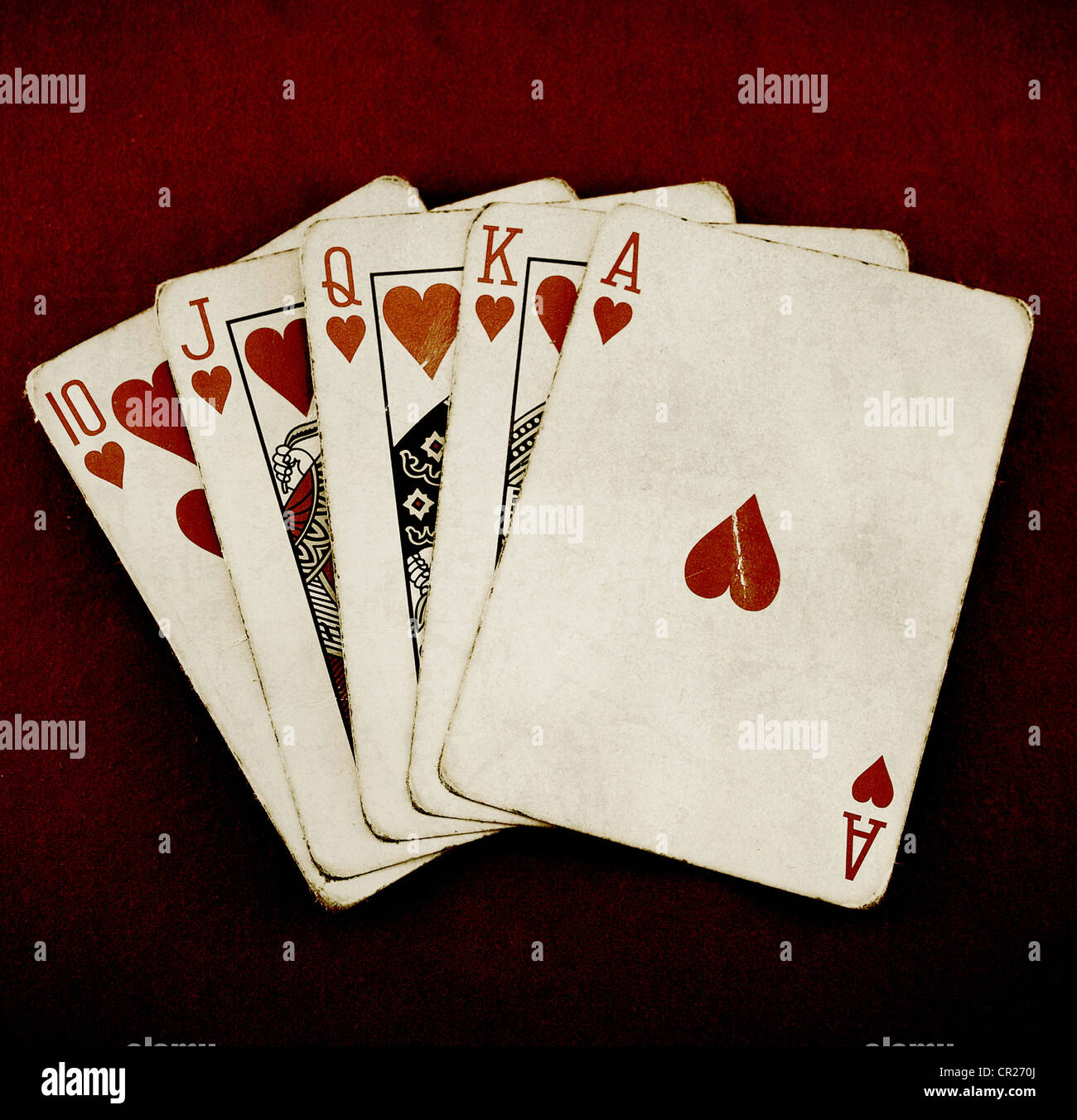 old royal flush on red felt Stock Photo - Alamy